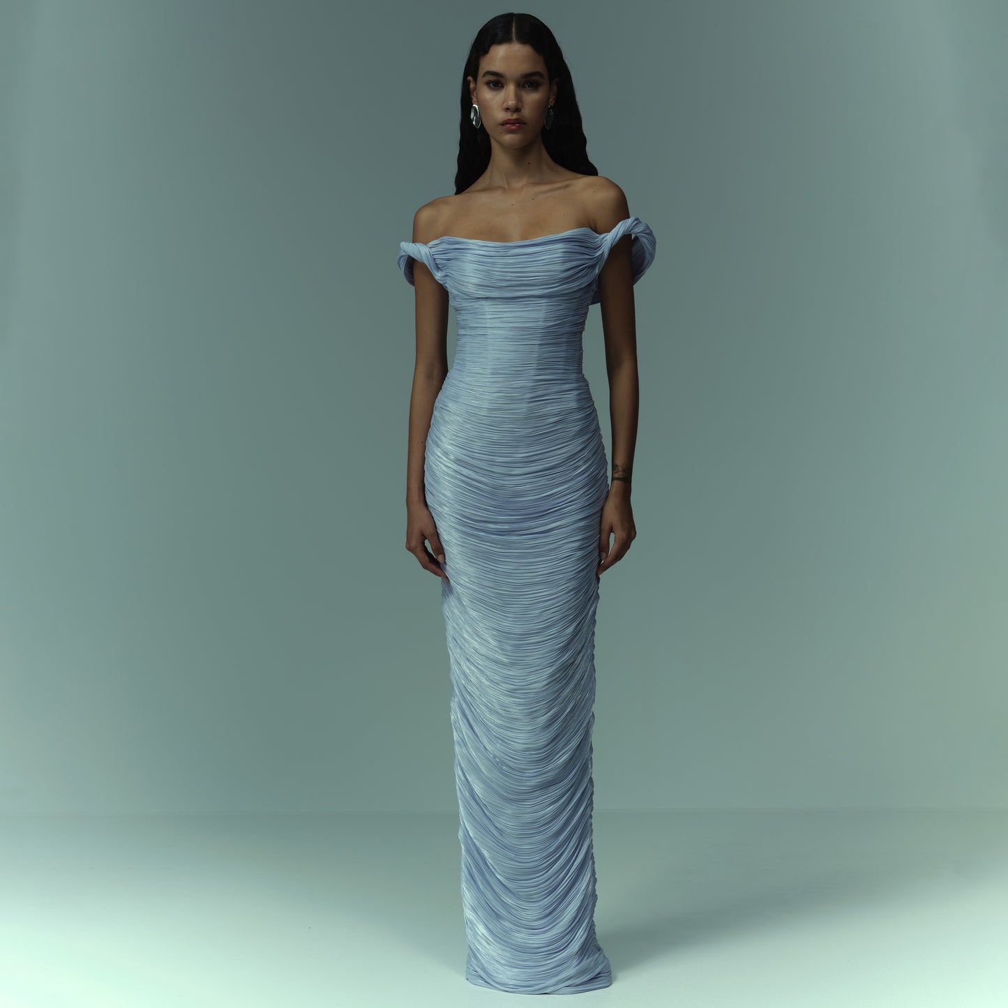 Off shoulder, hand pleated draped Satin-like gown with soft wires on t ...